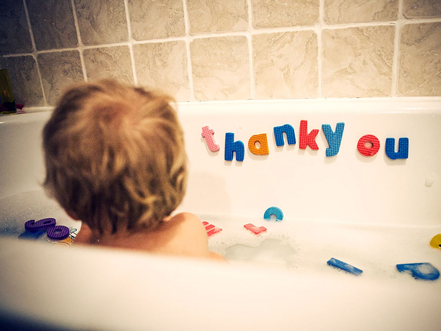 4 Ways to Add Literacy Learning to Bath Time